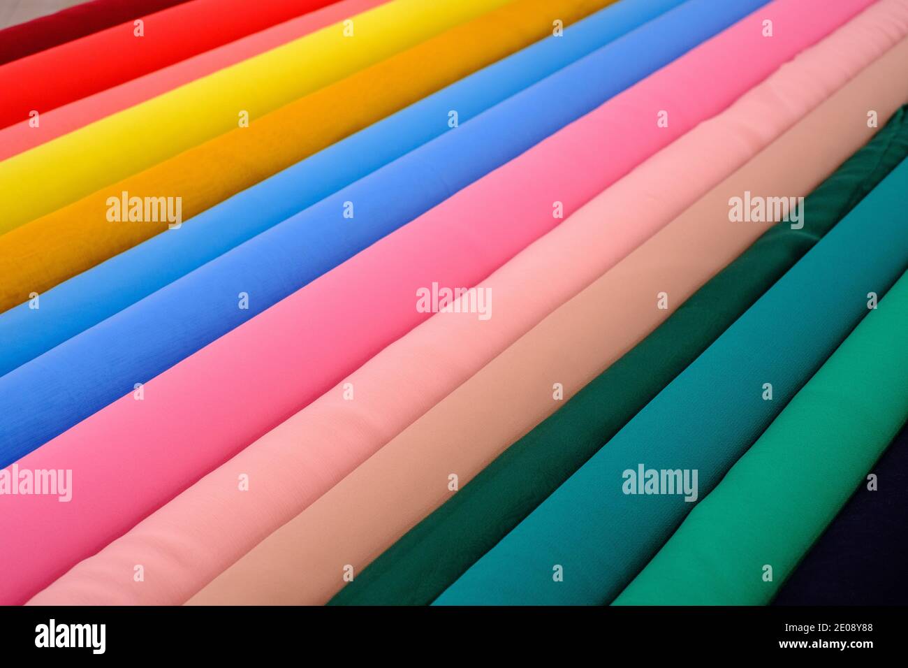 multicolored pattern created by rolls of fabric together next to each ...