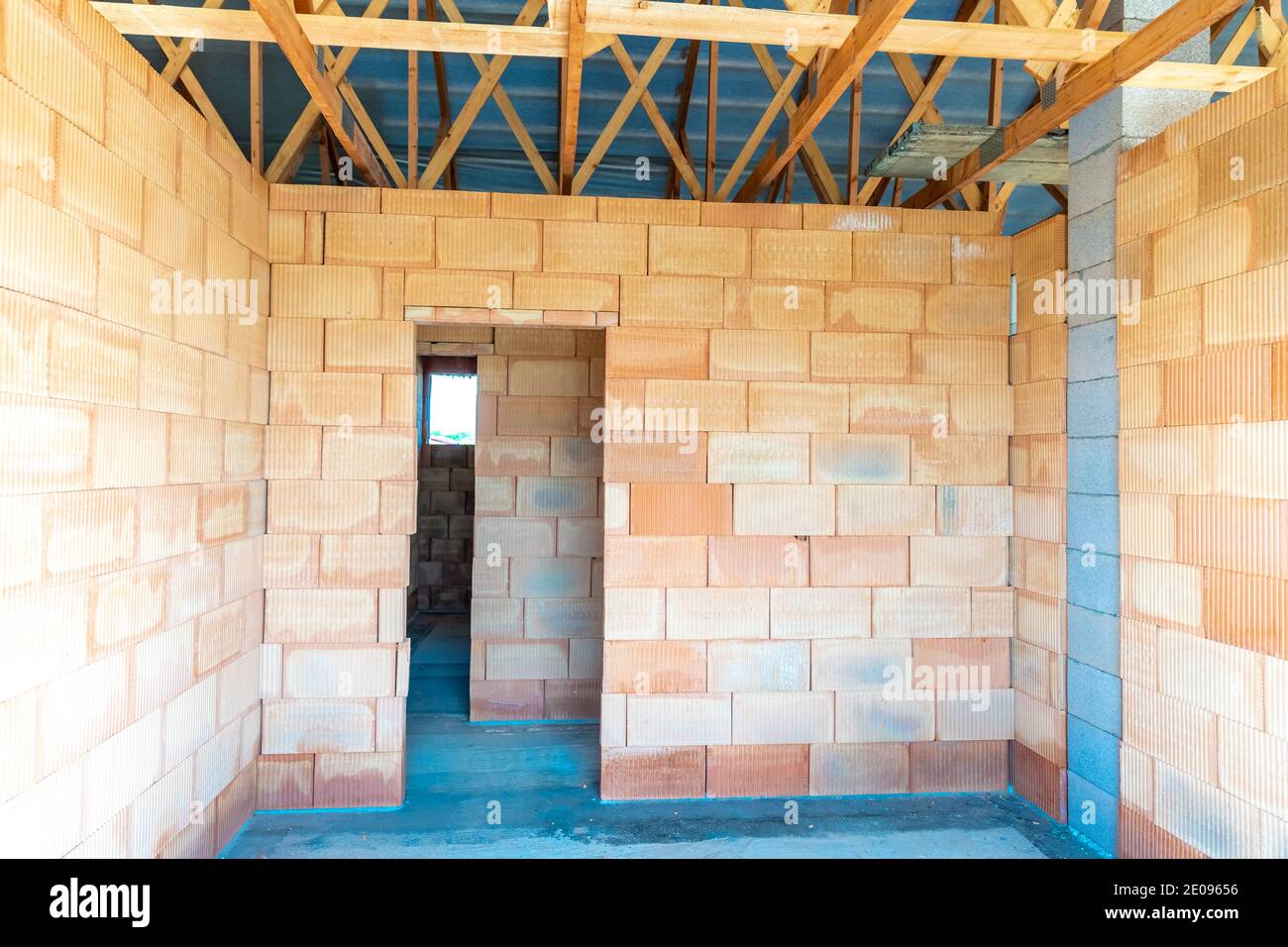 rough construction of a brick family house Stock Photo - Alamy