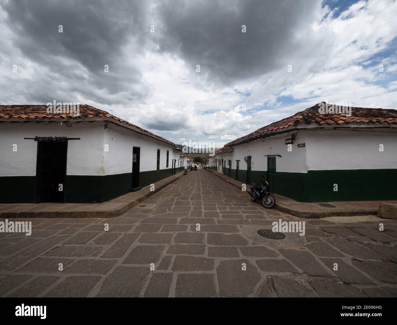 Classic white house walls and cobblestone streets in colonial ...