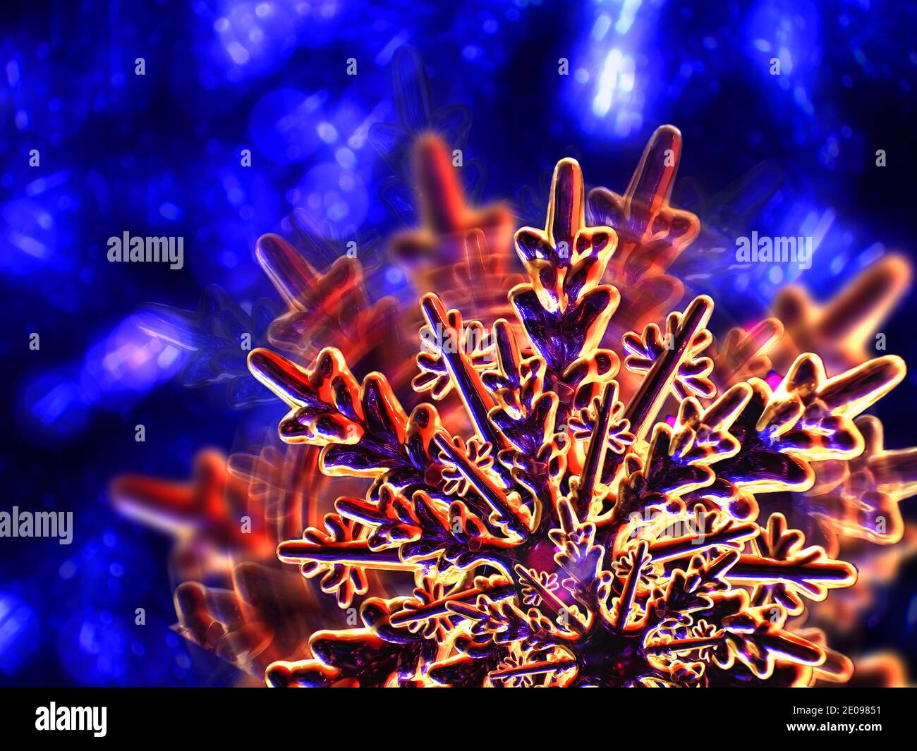 Creative series of artificial snowflakes illuminated with warm fire ...