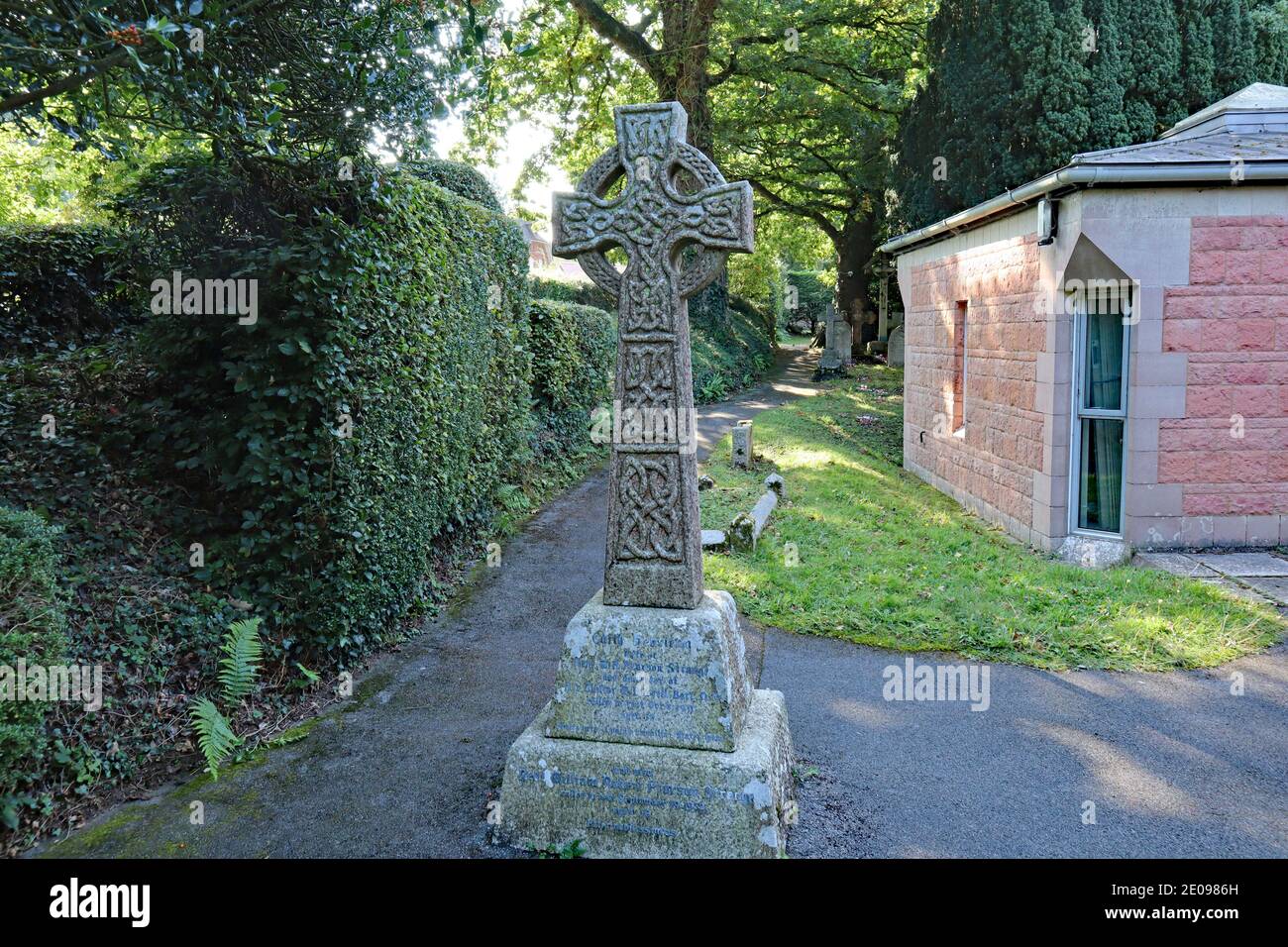 A Celtic Cross at the entrance to the graveyard in a village in Devon ...