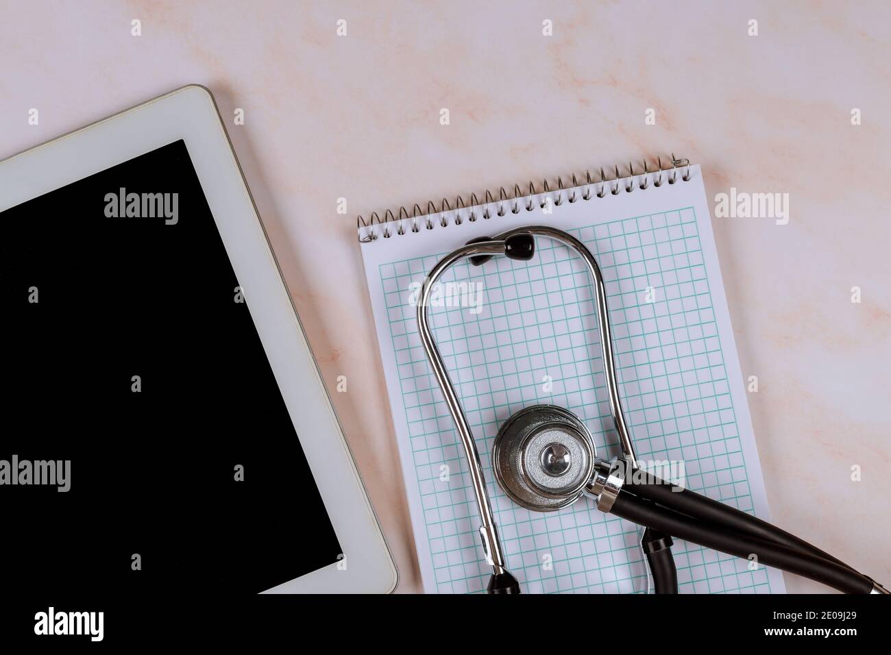 White sheet paper with phonendoscope stethoscope, digital tableton ...