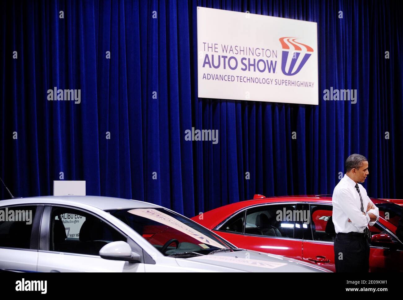 U.S. President Barack Obama looks at cars during a visit to the DC Auto ...