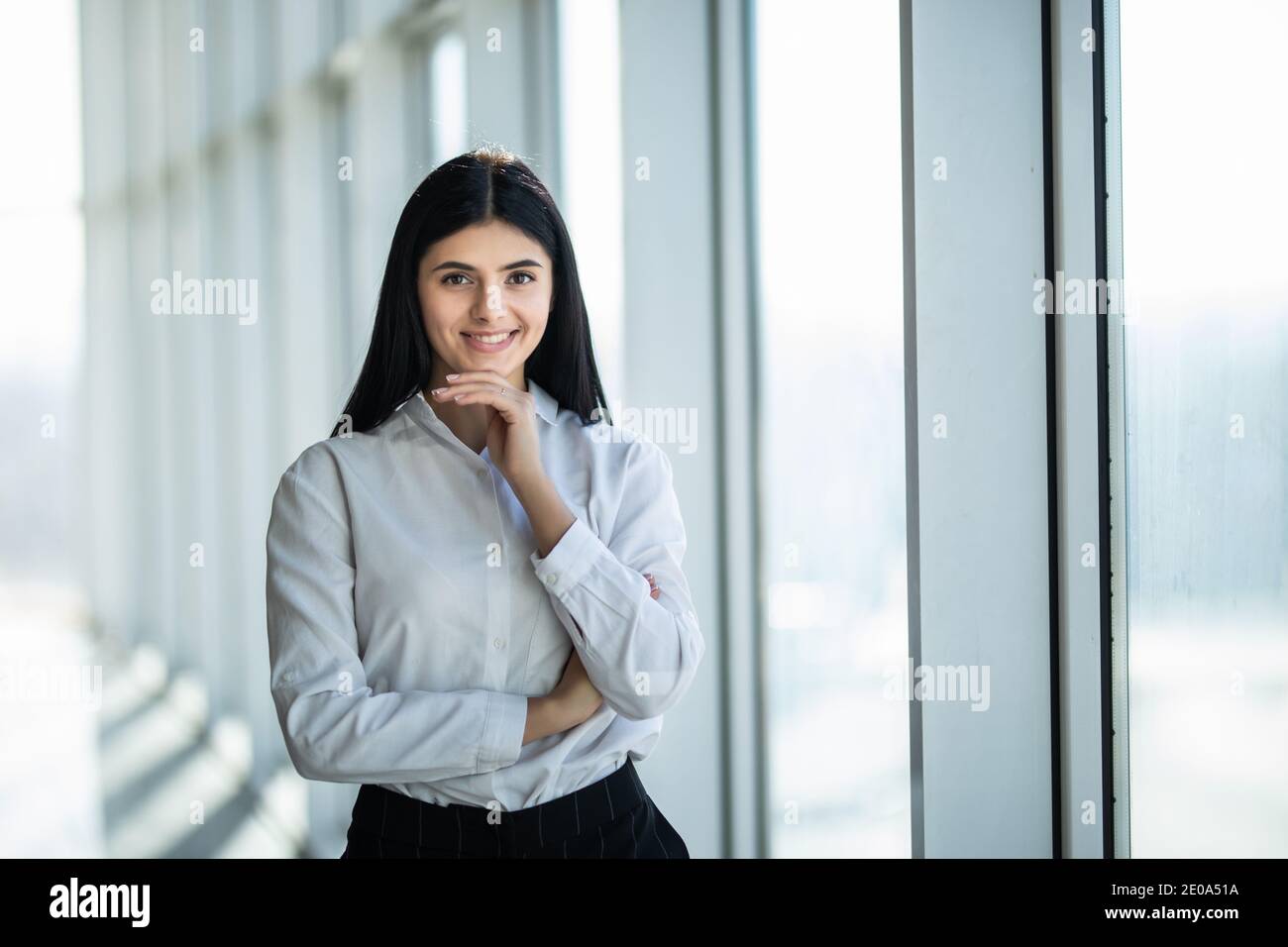 Thoughtful dreamy businesswoman ceo executive looking through office ...