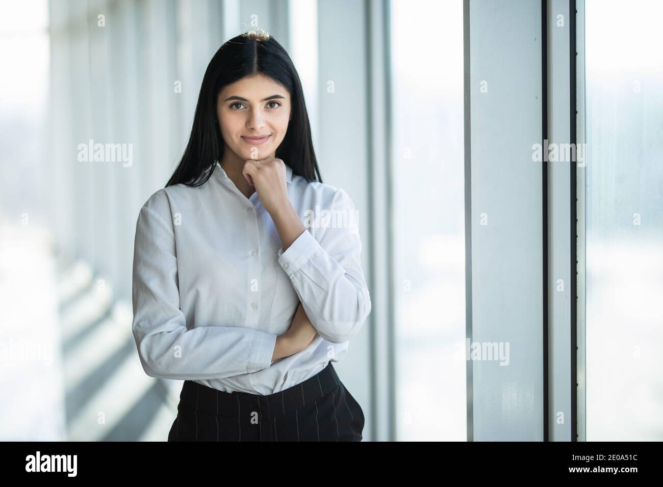 Thoughtful dreamy businesswoman ceo executive looking through office ...