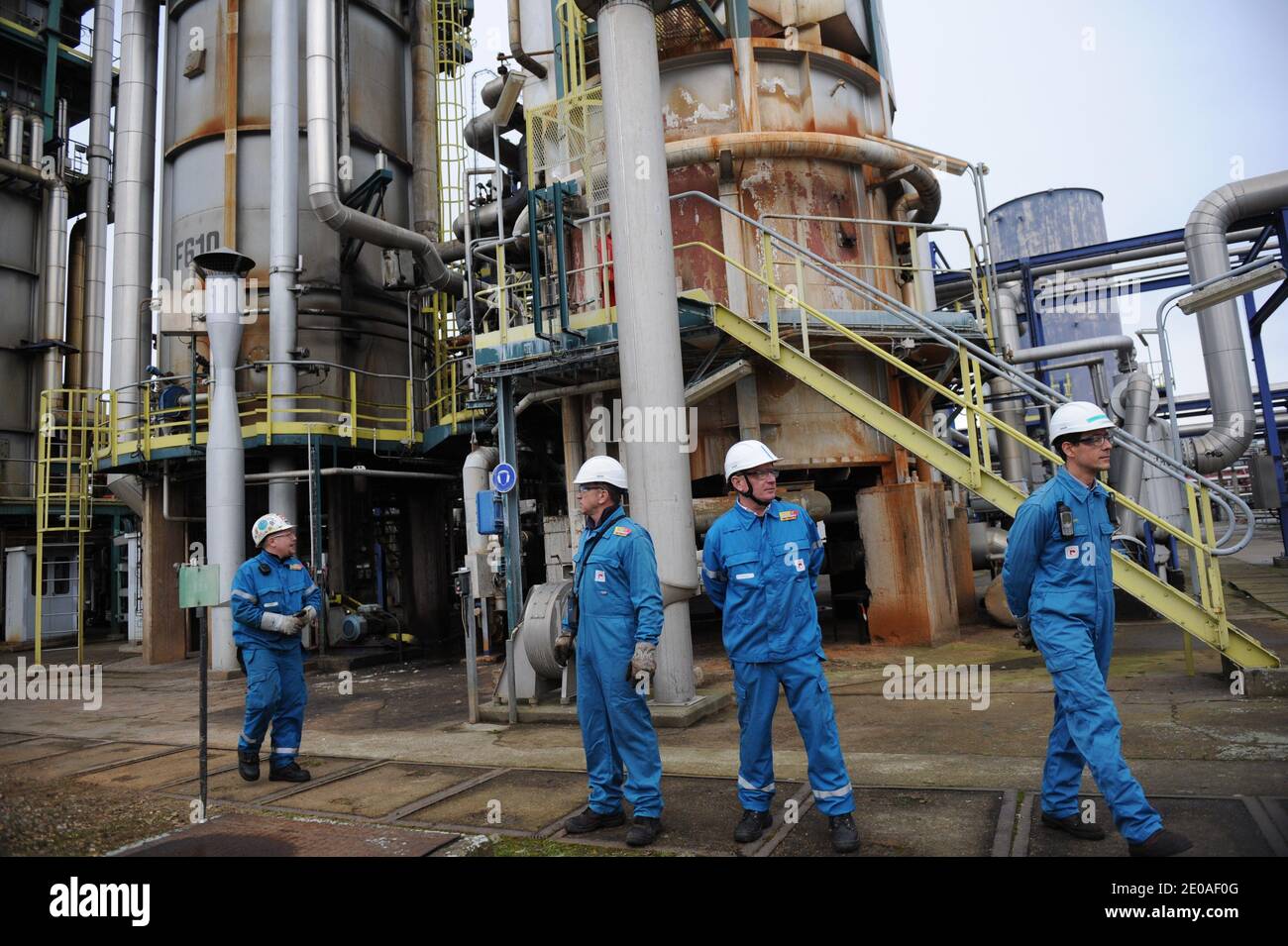 Workers are pictured at Swiss oil refinery Petroplus in Petit-Couronne ...