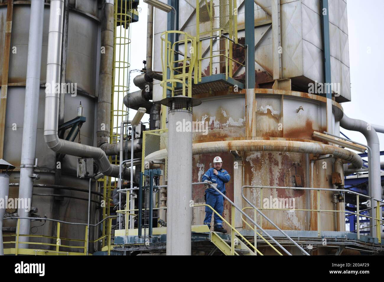 Workers are pictured at Swiss oil refinery Petroplus in Petit-Couronne ...