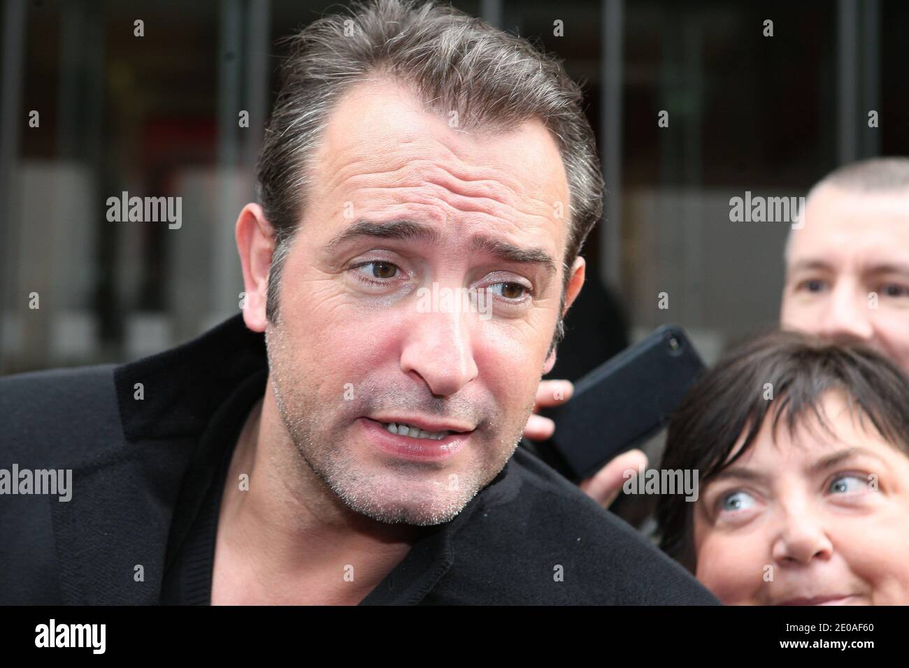 French actor Jean Dujardin signs autographs and poses for photographs ...