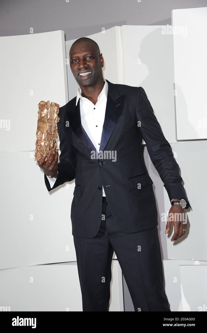 Omar Sy posing at the photocall during the 37th annual Cesar film ...