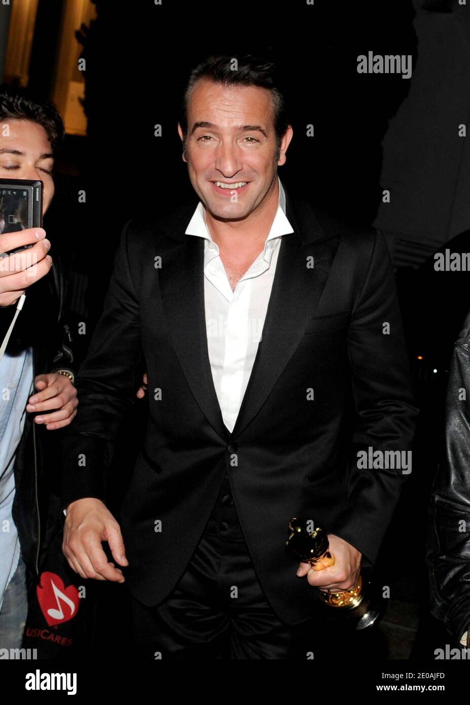 French actor Jean Dujardin with the Best Actor award arrives at 'The ...