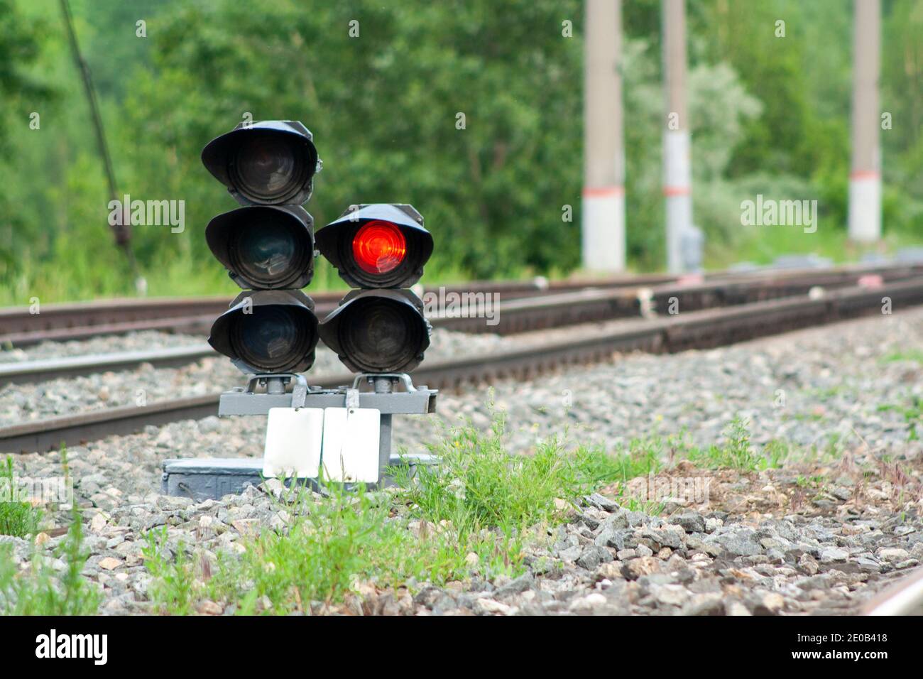 traffic light on railroad tracks close up Stock Photo - Alamy