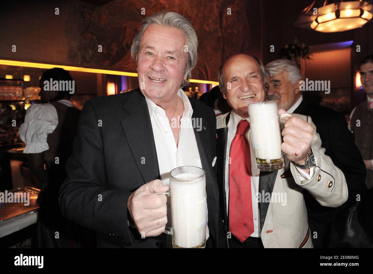 Alain Delon, Axel Ganz attending a Bavarian-themed Beer Fest hosted by ...