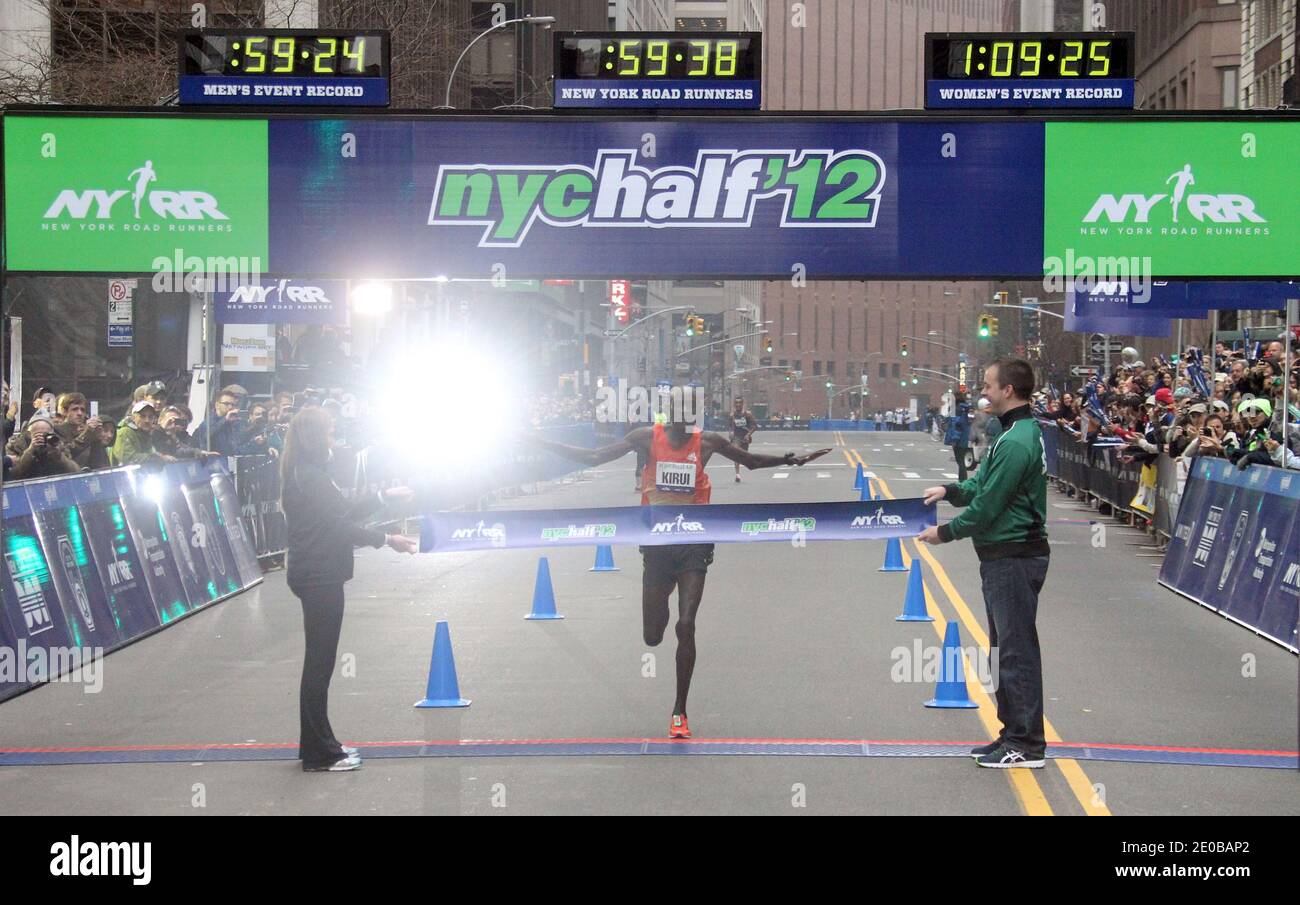 Peter Kirui of Kenya crosses the finish line and won the New York City ...