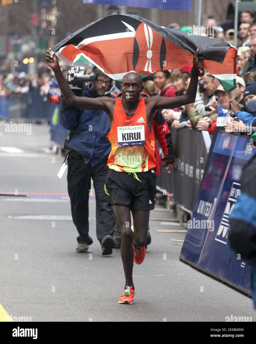Peter Kirui of Kenya crosses the finish line and won the New York City ...