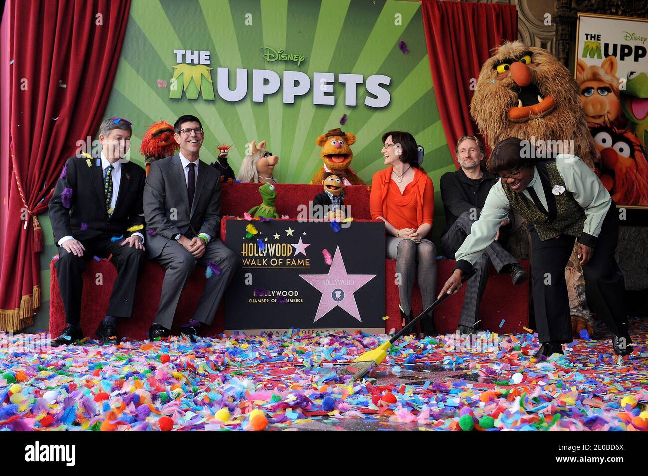 Leron Gubler, Rich Ross and Lisa Henson pose during the ceremony where ...