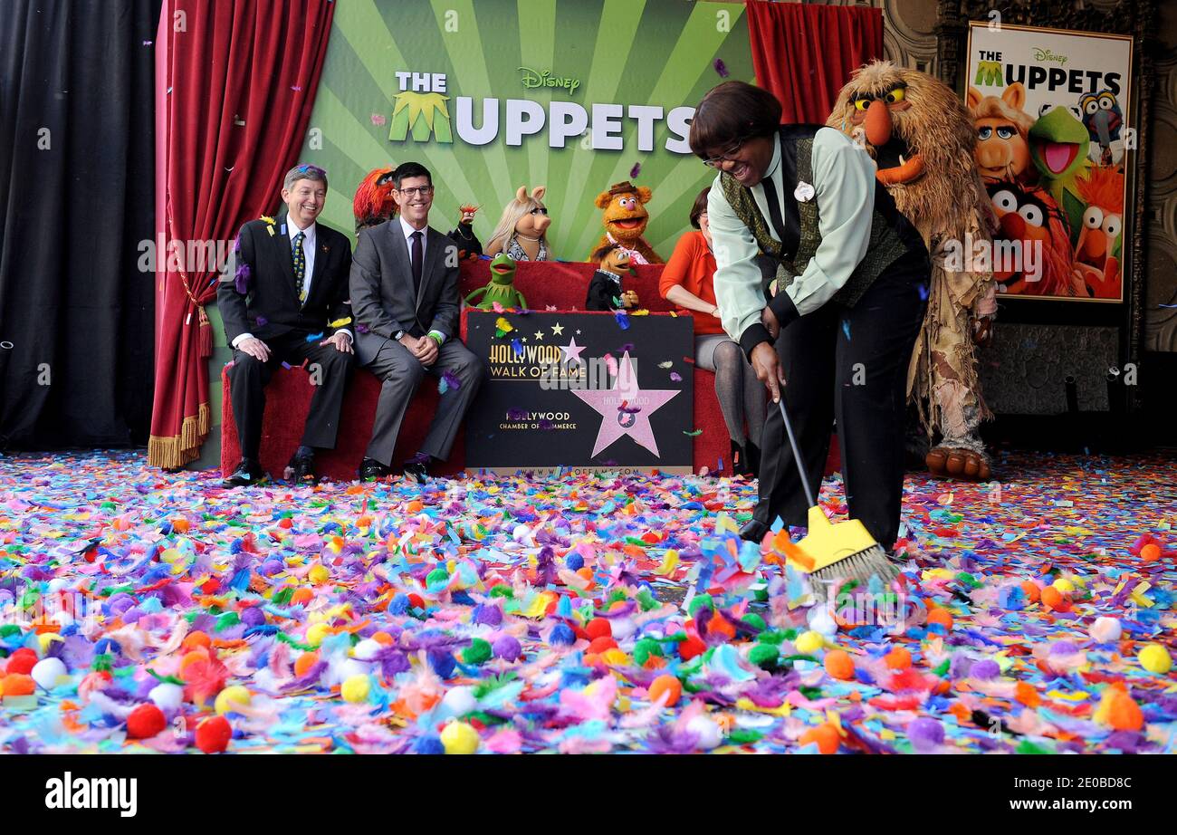 Leron Gubler, Rich Ross and Lisa Henson pose during the ceremony where ...