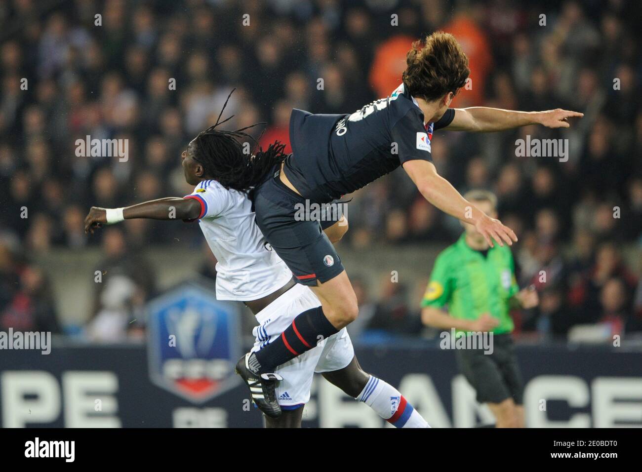 PSG's Diego Lugano battling Lyon's Bafetimbi Gomis during the French ...