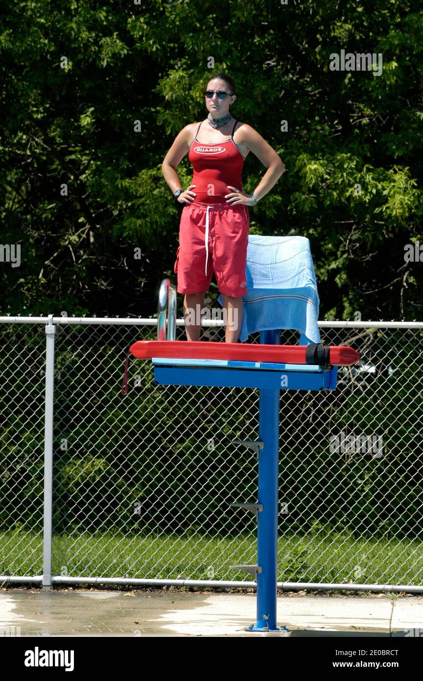 Life guard on duty at a public swimming pool Stock Photo - Alamy