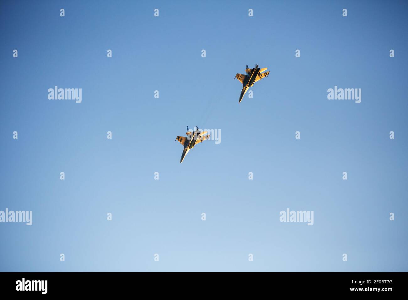 Two military fighter jets show teamwork in the air. War. Aviation Stock ...
