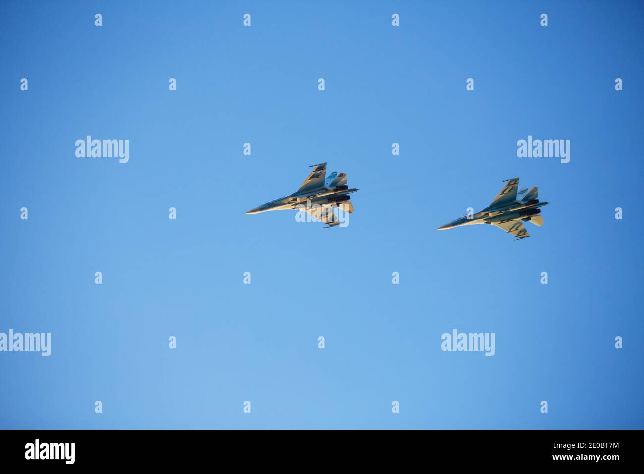 Two military fighter jets show teamwork in the air. War. Aviation Stock ...
