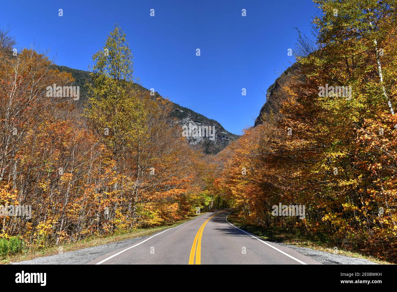 Road view of late fall foliage in Smugglers Notch, Vermont Stock Photo ...