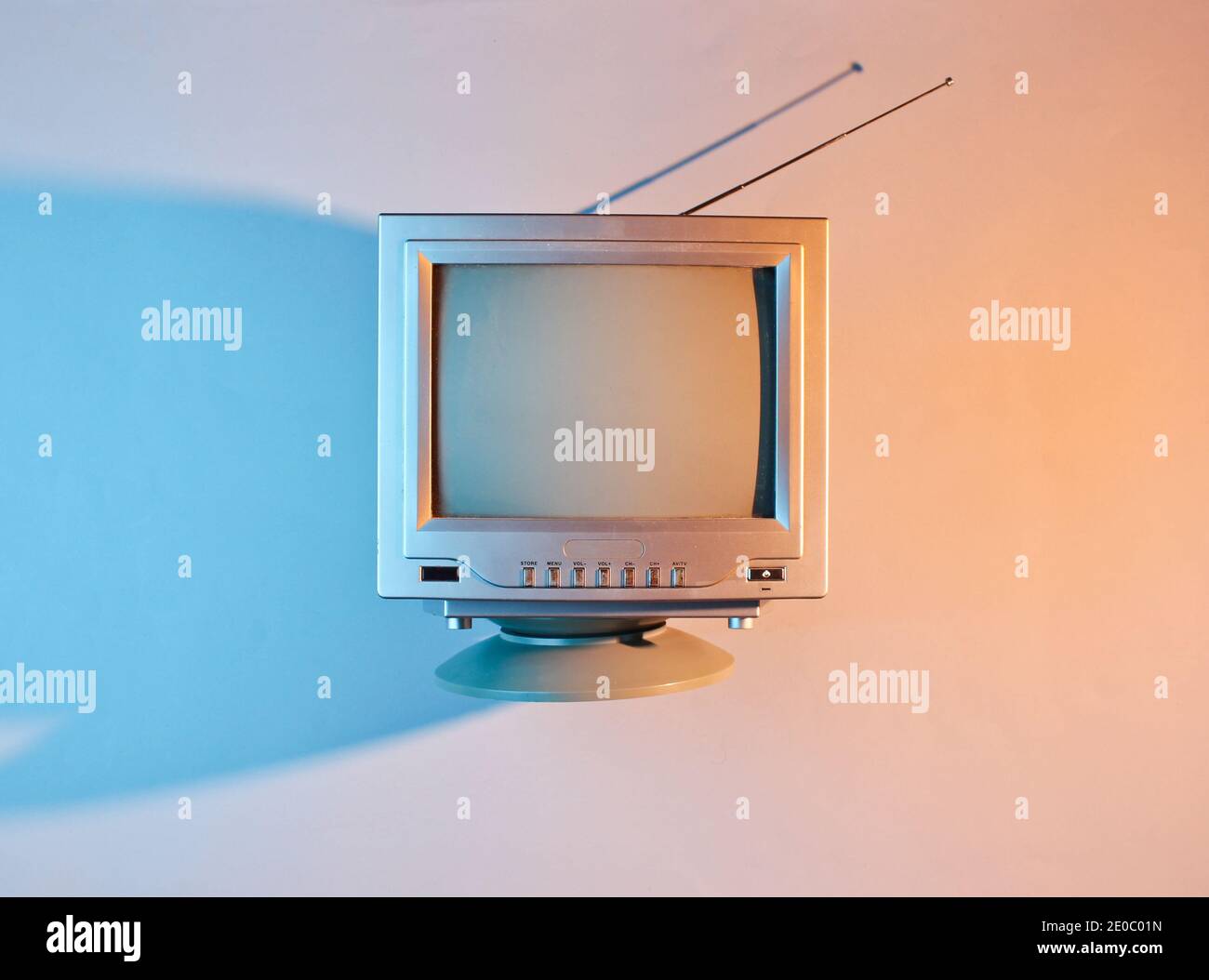 Retro wave, 80s. Old tv with antenna with neon light. Top view ...