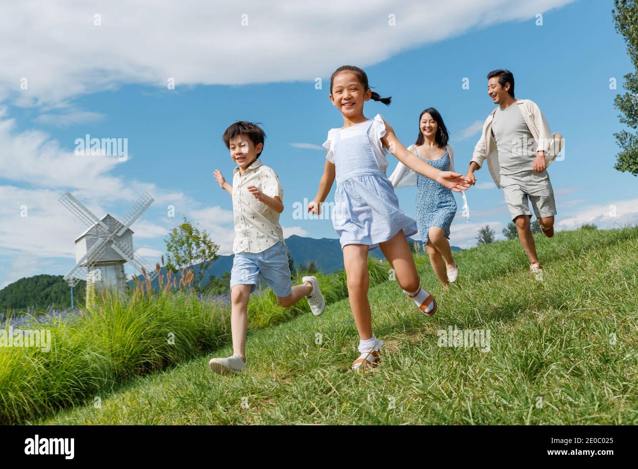 A family of four in outside for a walk Stock Photo - Alamy
