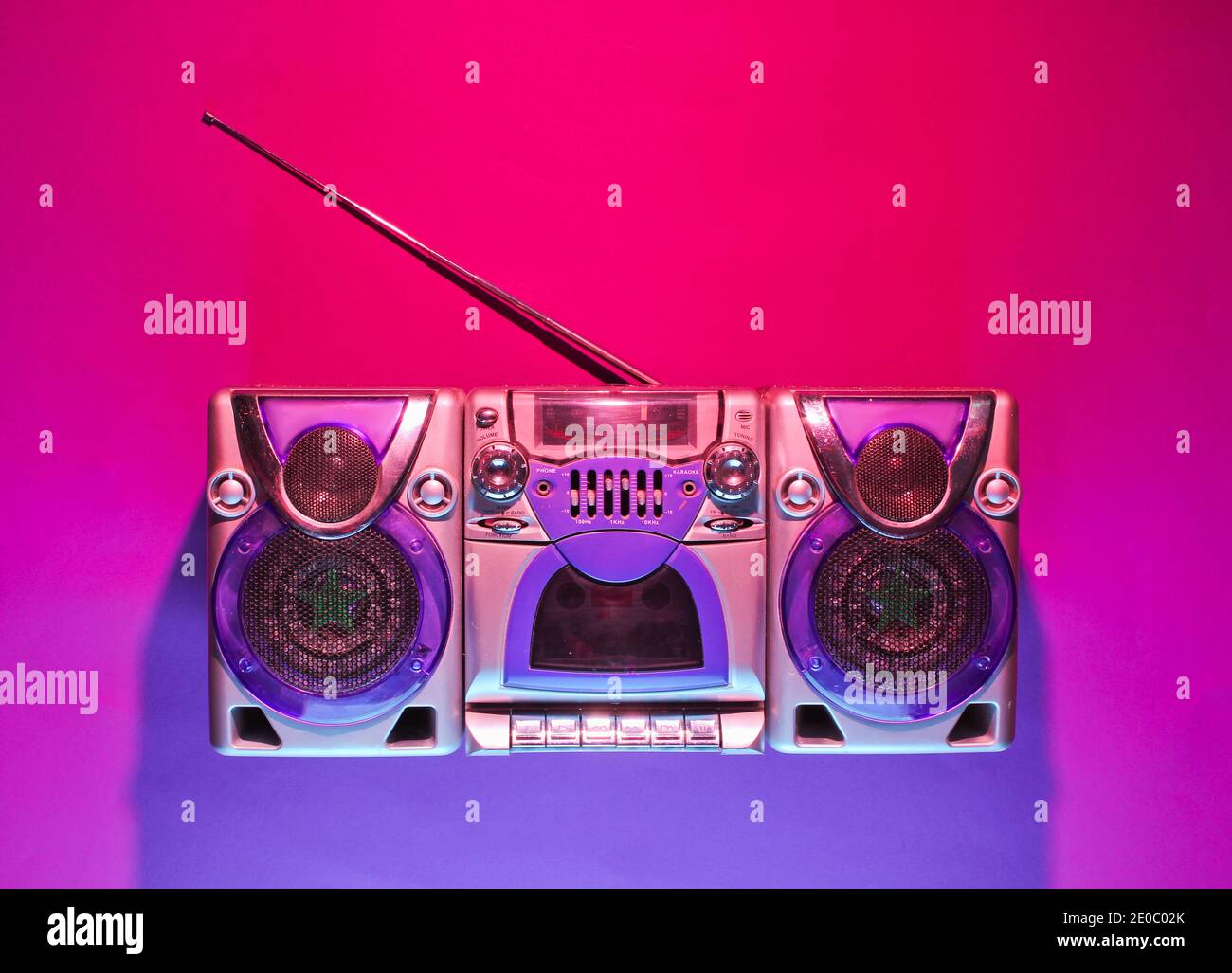 Retro wave style audio cassette recorder with neon pink-magenta light ...