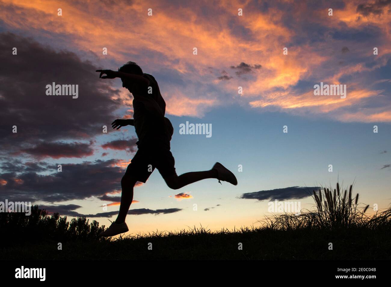 The young man in the sunset Stock Photo - Alamy