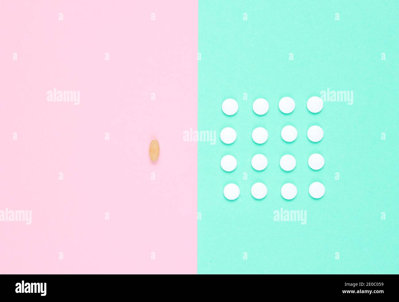 Minimalistic medical concept. A group of identical white tablets and ...