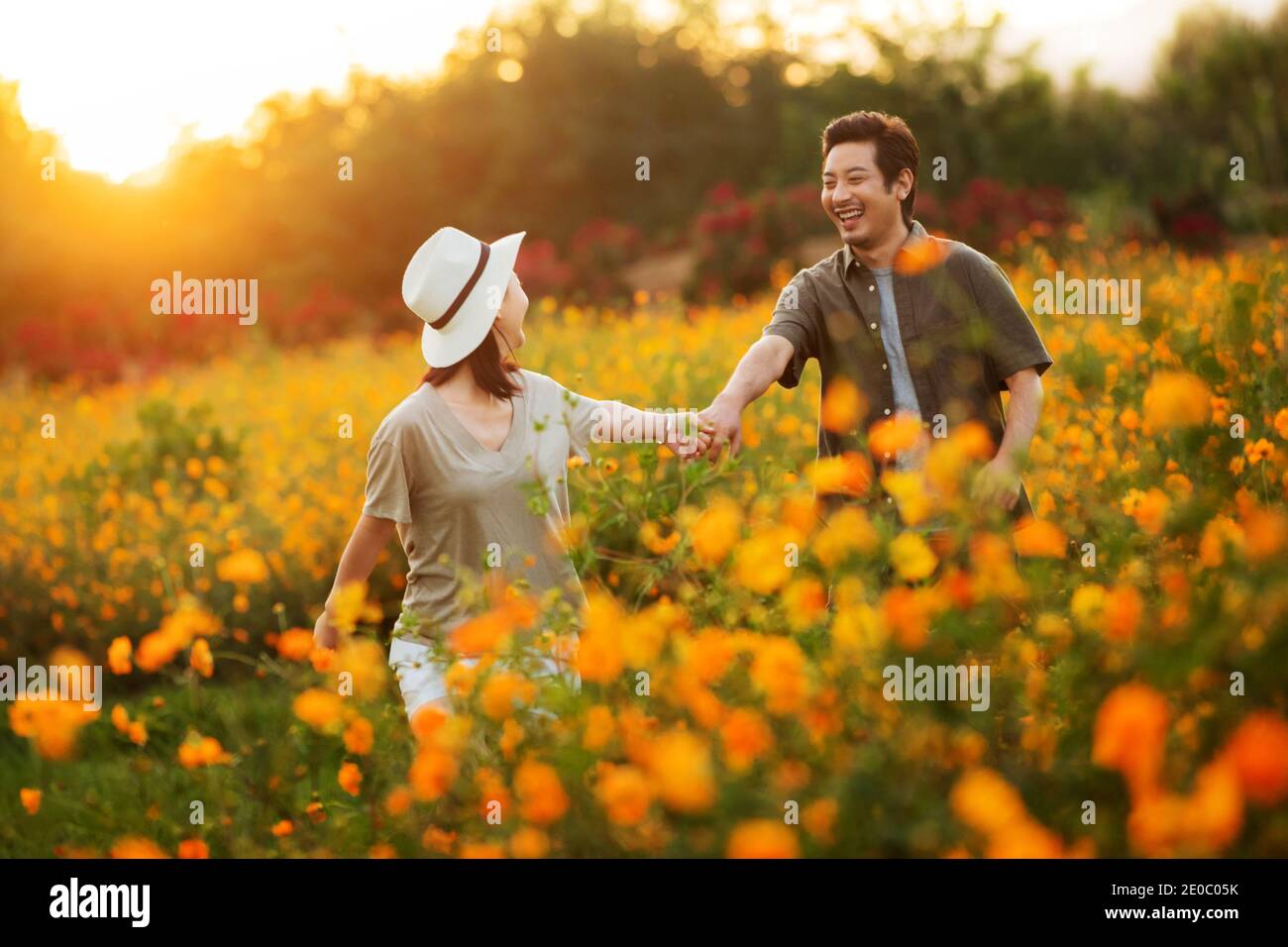 The flowers in the happy young couple Stock Photo - Alamy