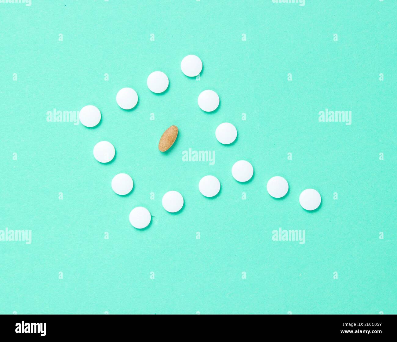 Minimalistic medical concept. A group of identical white tablets and ...