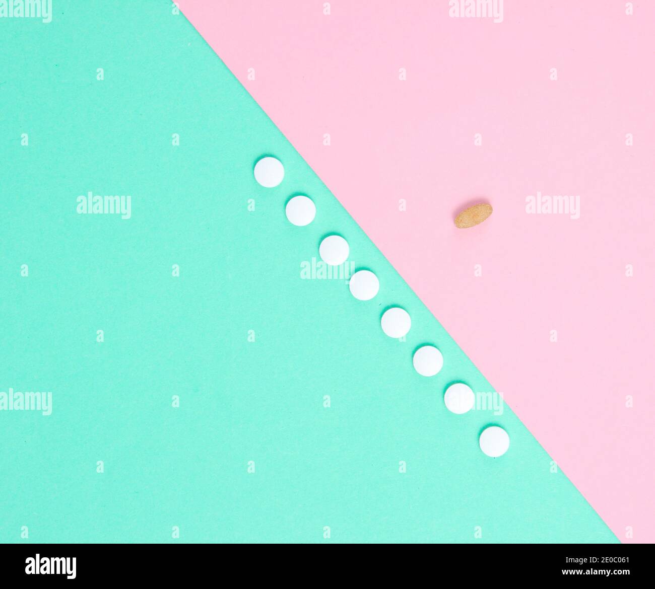 Minimalistic medical concept. A group of identical white tablets and ...