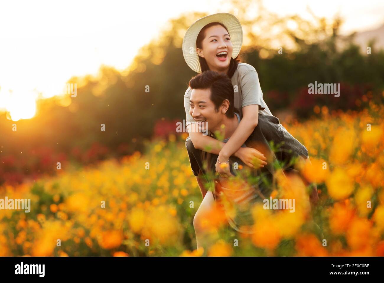 The flowers in the happy young couple Stock Photo - Alamy