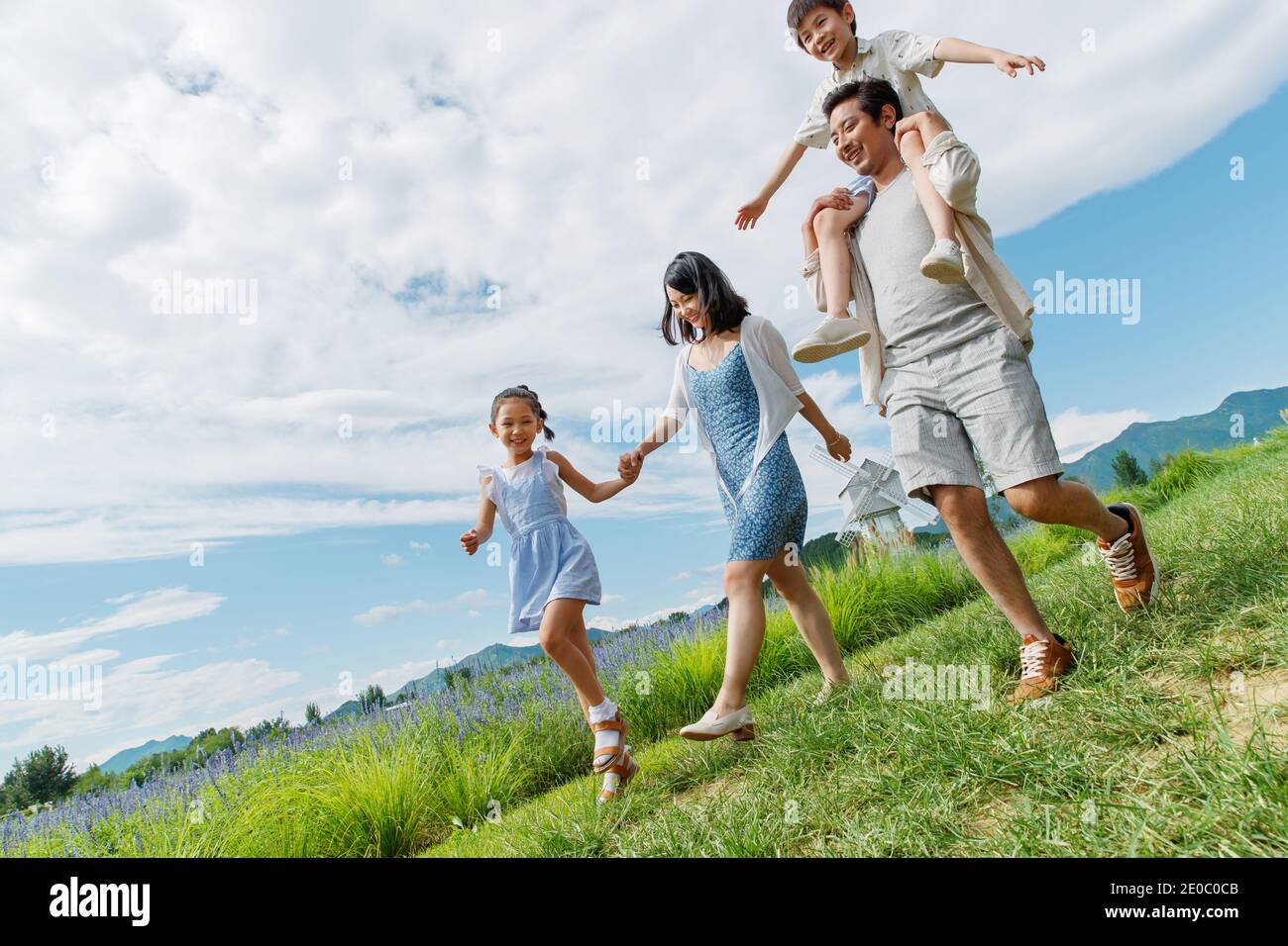 A family of four in outside for a walk Stock Photo - Alamy