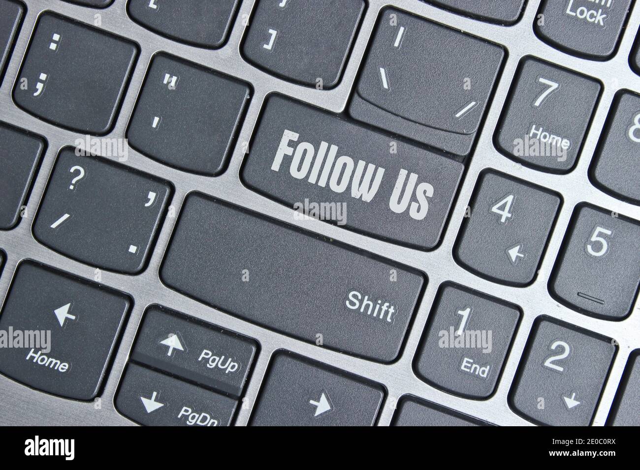 Inscription follow us on the keyboard keys Stock Photo - Alamy