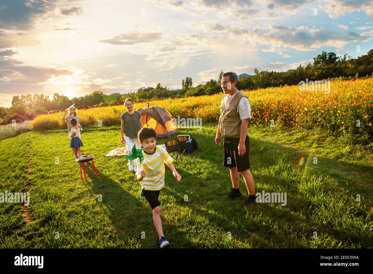 Happy family in the outdoor outing Stock Photo - Alamy