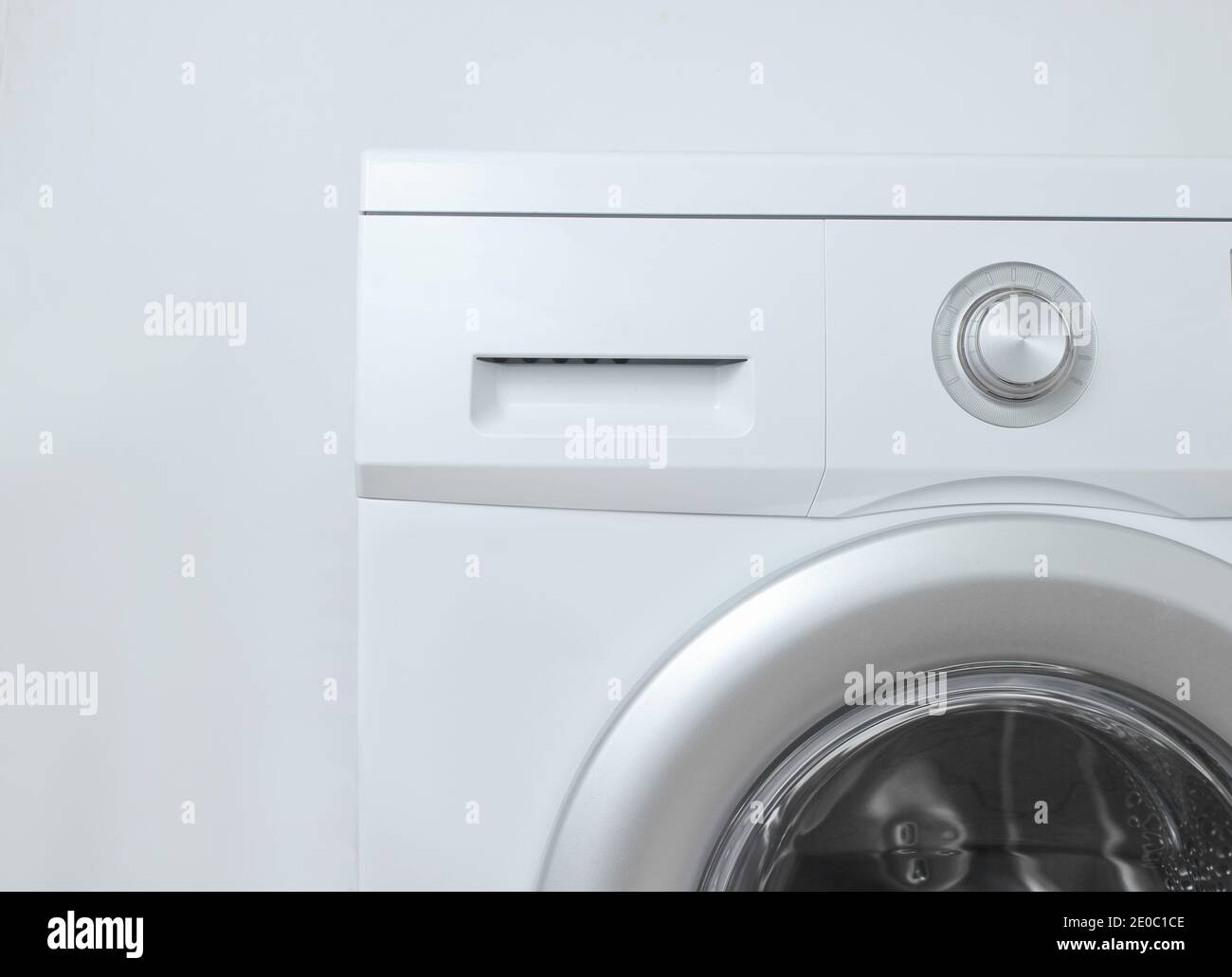 Washing machine against a white background Stock Photo - Alamy