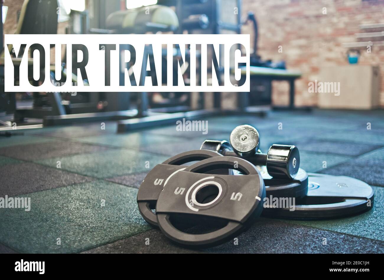 Inscription word "Your training". Barbell, dumbbells lie on the floor ...