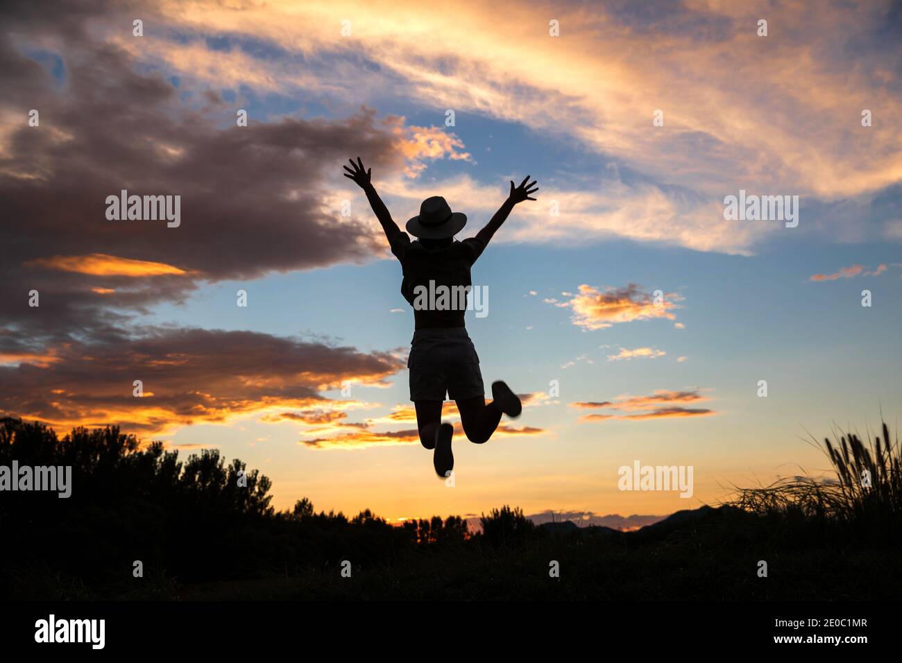 Women sunset jumping hi-res stock photography and images - Alamy