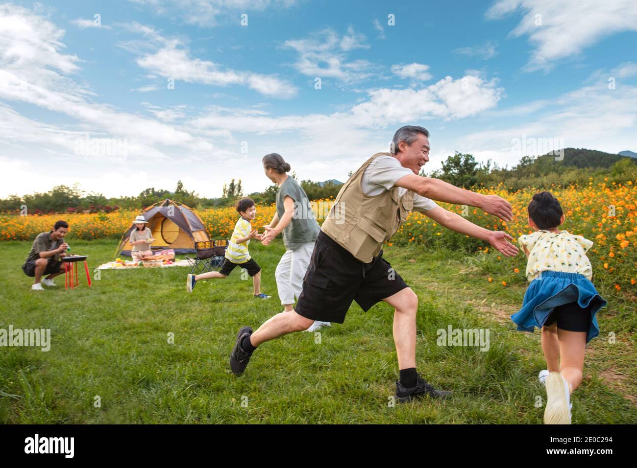 Happy family in the outdoor outing Stock Photo - Alamy
