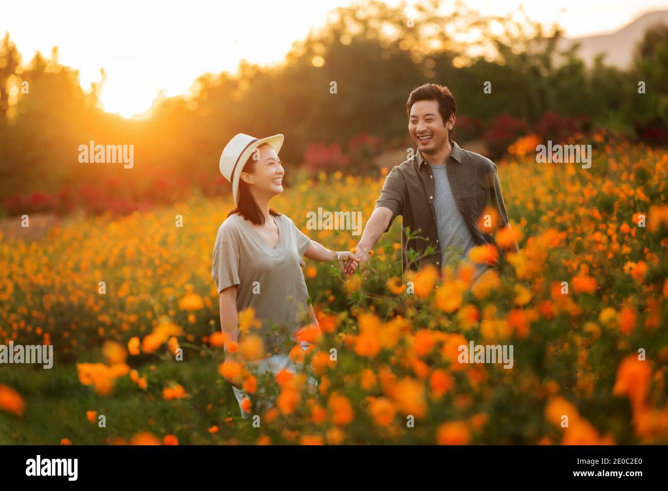 The flowers in the happy young couple Stock Photo - Alamy