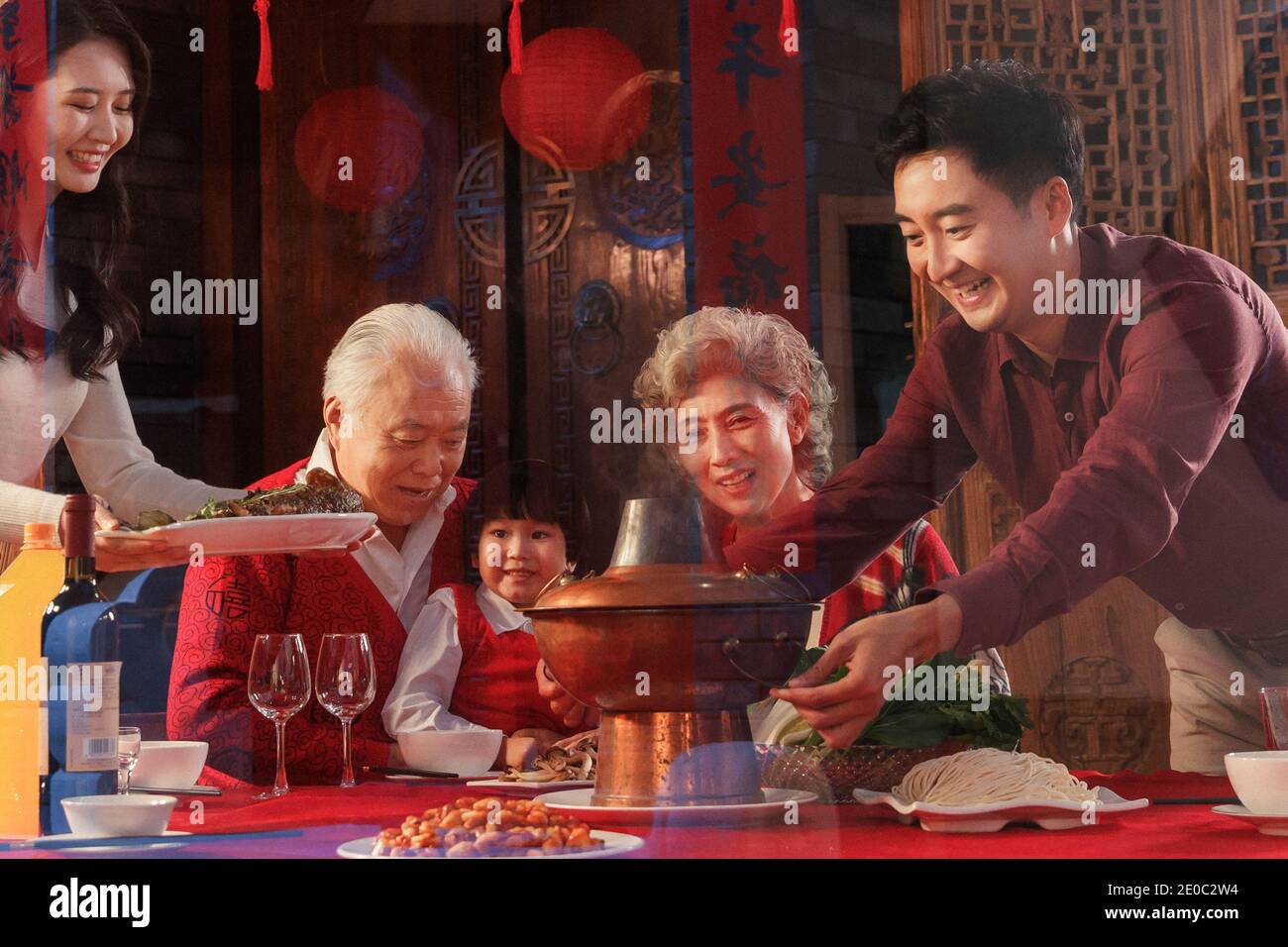 Happy Chinese New Year reunion dinner Oriental families Stock Photo - Alamy