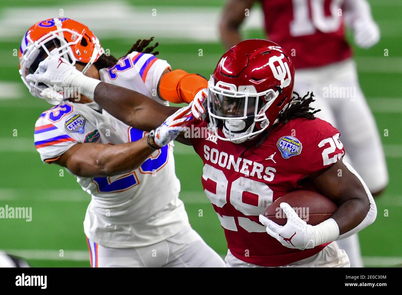 Oklahoma Sooners running back Rhamondre Stevenson (29) stiff arms ...