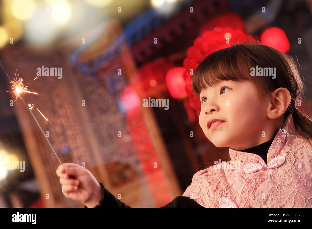 The lovely little girl with fireworks Stock Photo - Alamy