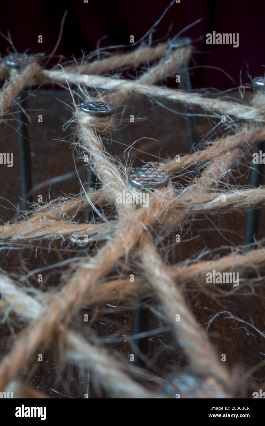 a symbol picture for networking and teamwork. nails are connected by ...