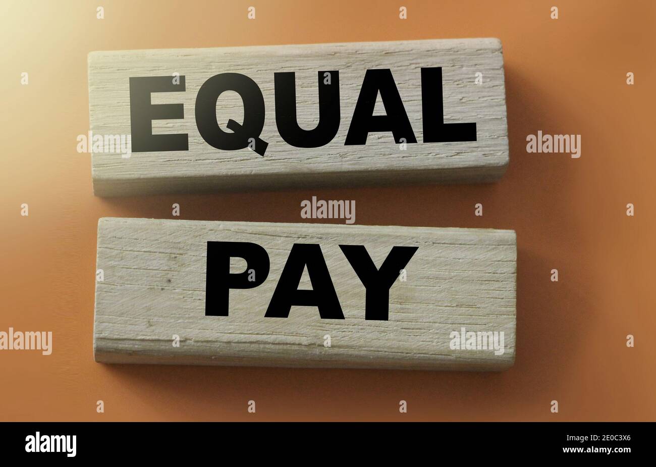 Equal pay words on wooden blocks. Income differences between men and ...