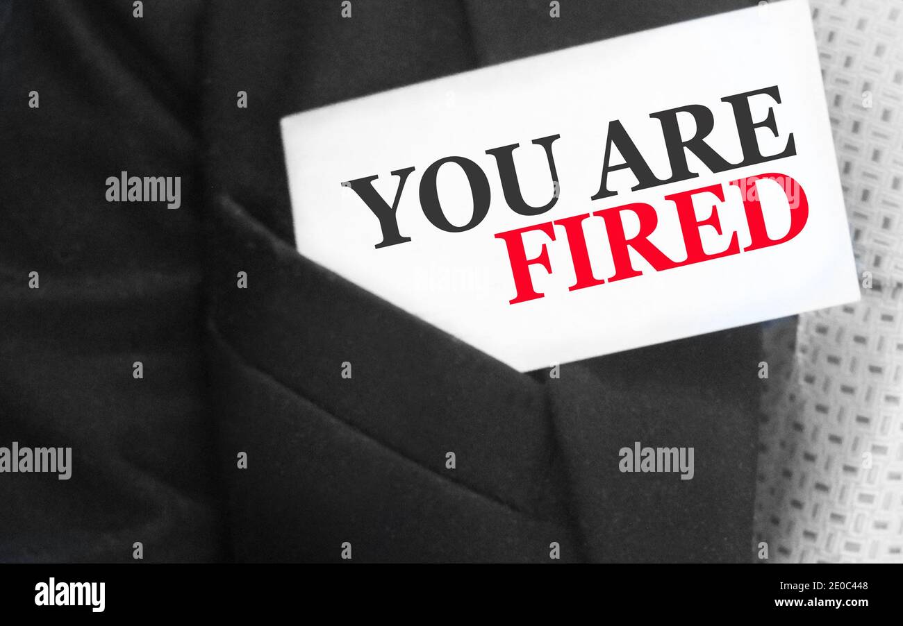 Card with text You are fired in businessman suit upper pocket. Business ...