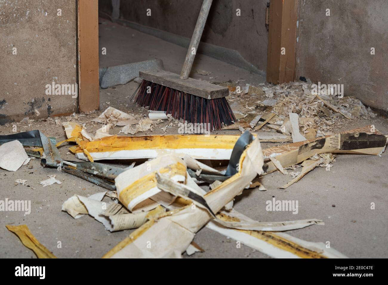 Garbage and broom inside of house in repair time Stock Photo - Alamy