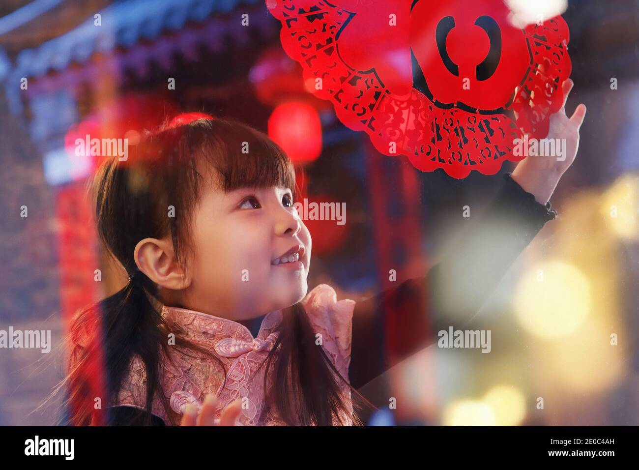 Cute girl paste paper-cut Stock Photo - Alamy